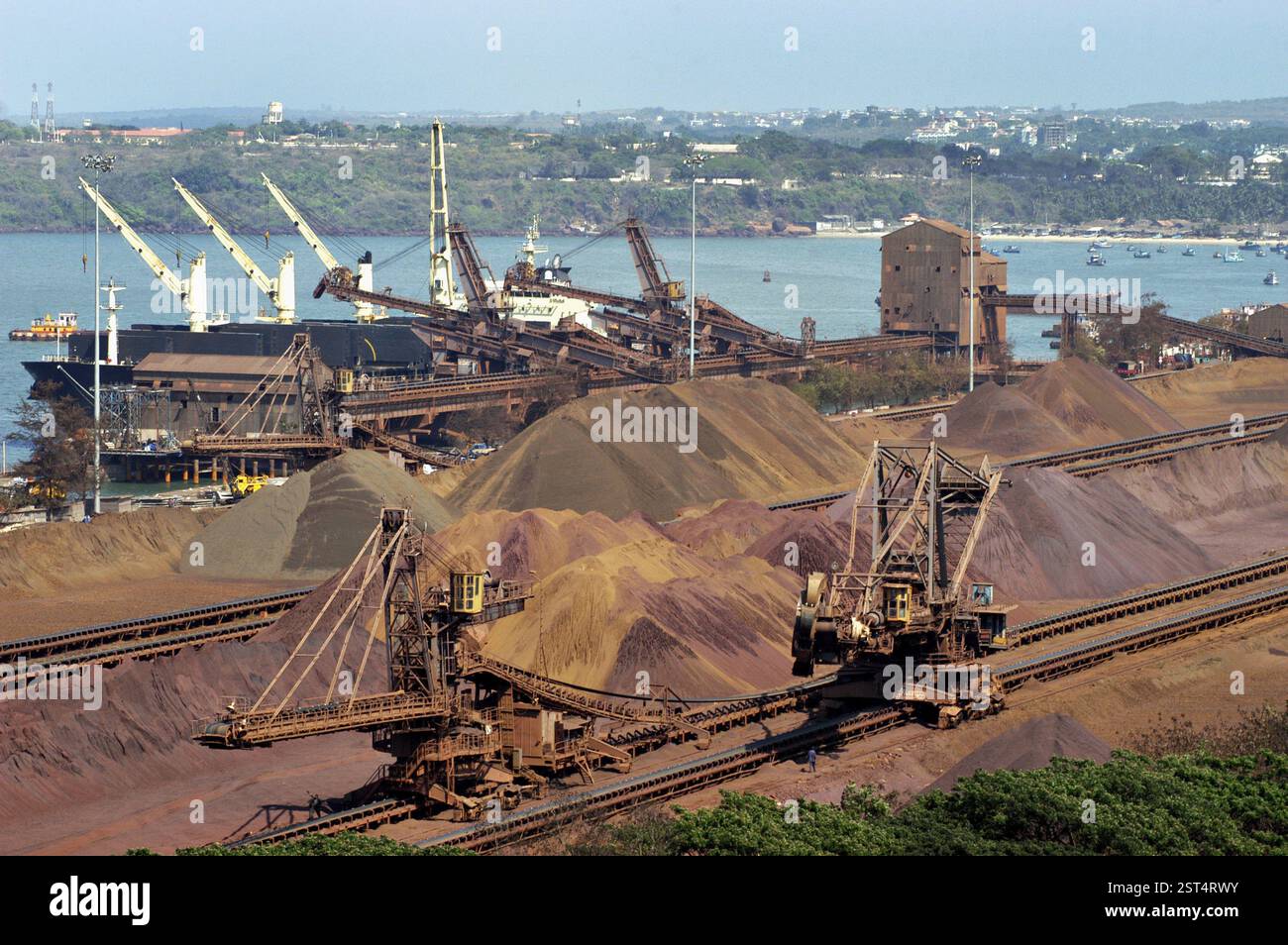 Shipping, Iron ore waiting to be loaded on to bulk carrier ships in the ...