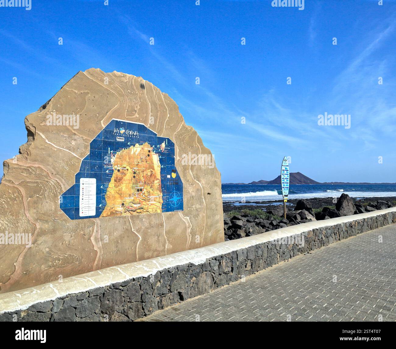 Large rock with tourist information map on the promenade with Lobos ...