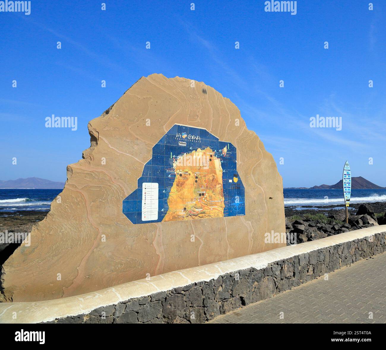 Large rock with tourist information map on the promenade with Lobos ...