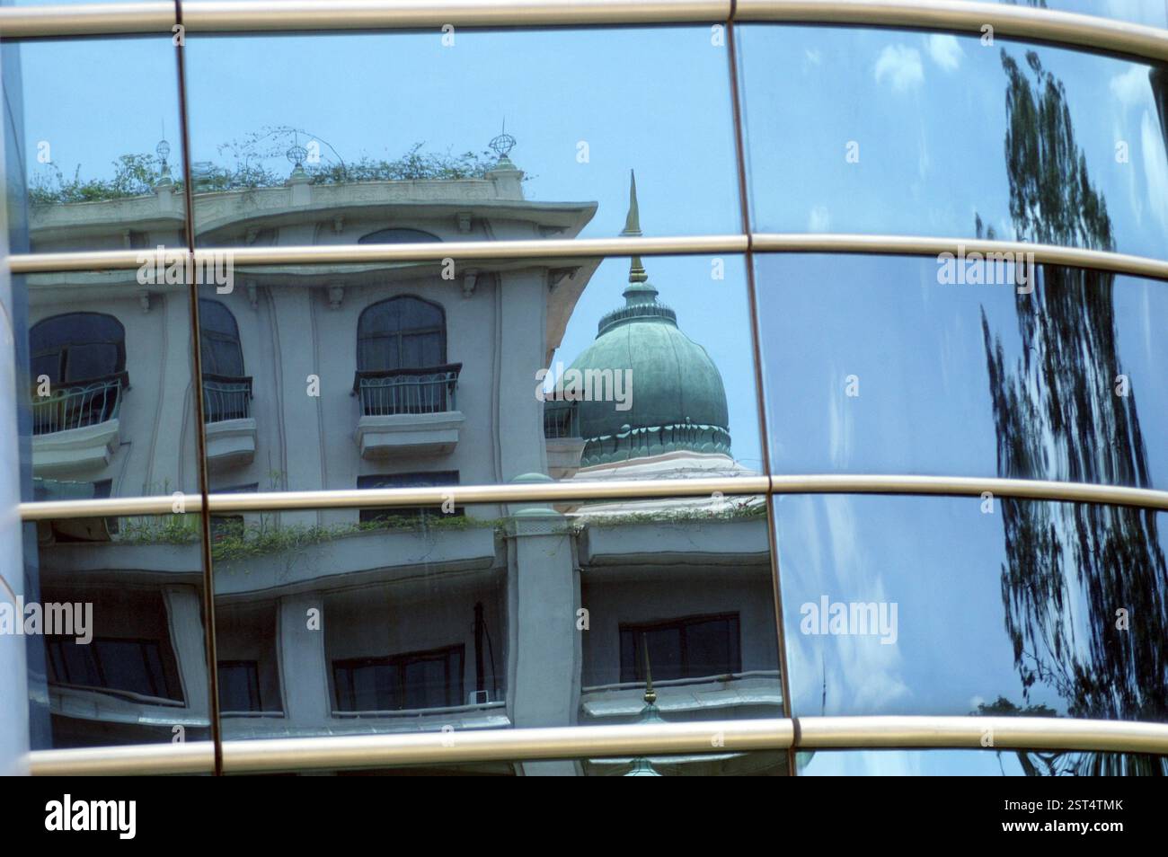 Reflection of a building on RMZ Corp, RMZ Titanium building a modern ...