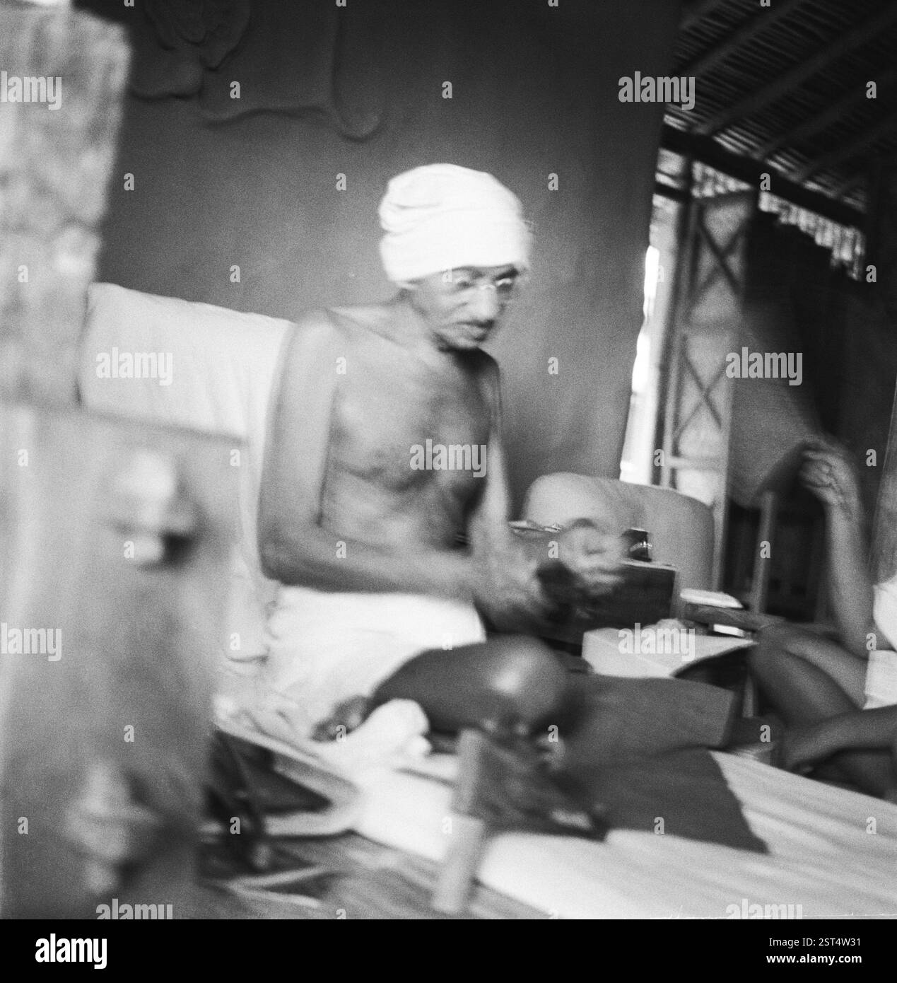 Mahatma Gandhi spinning in his hut at Sevagram Ashram, Vardha ...