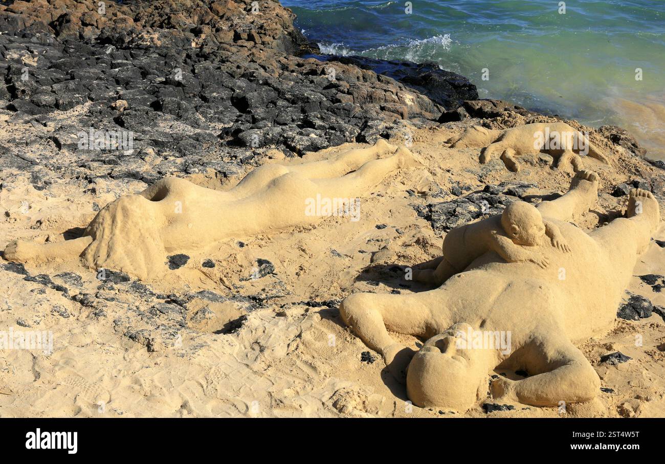 Sand art figures - man woman dog baby - sunbathing, Corralejo ...