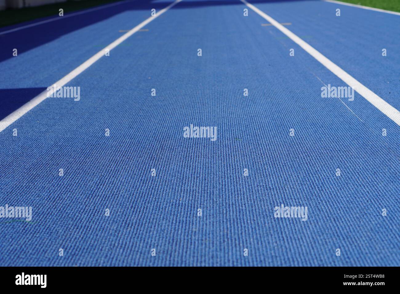 blue athletics track background with texture and white lines Stock ...