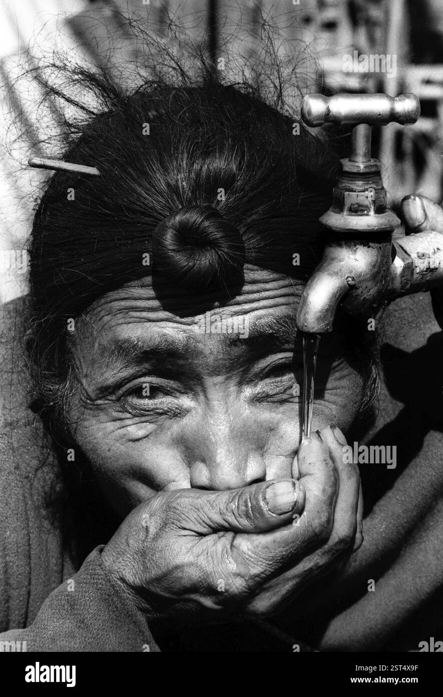 Member of Apa Tami tribe helps himself to potable water from a newly ...