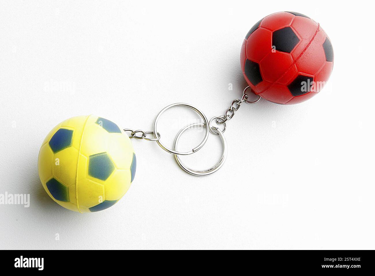 Two key chains made of small yellow and blue, red and black rubber ...