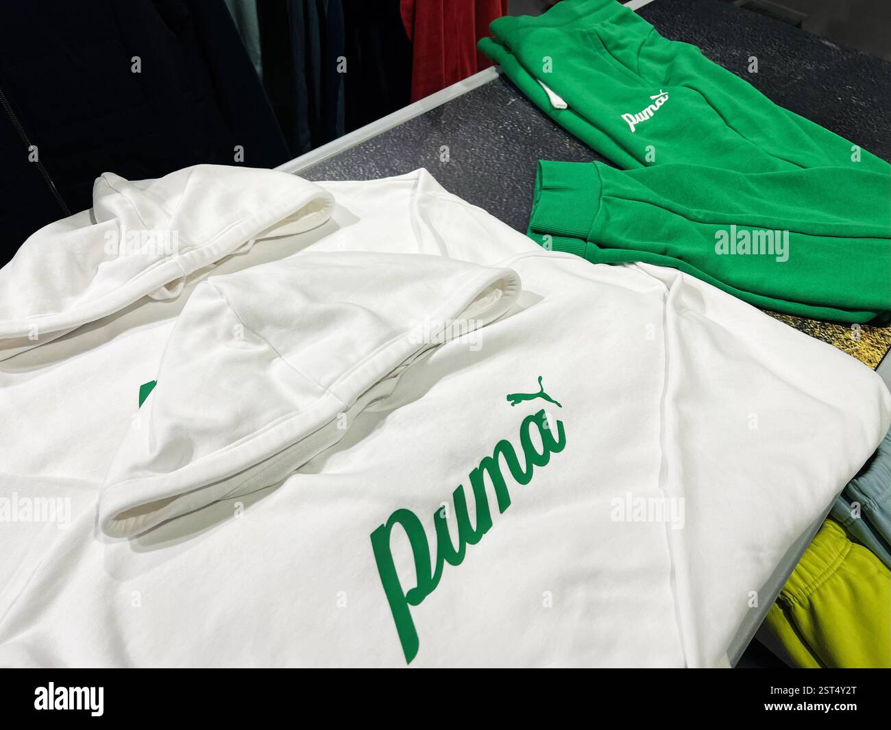 Lviv, Ukraine - February 16, 2025: Hoodies and pants from a popular brand Puma displayed on a ...