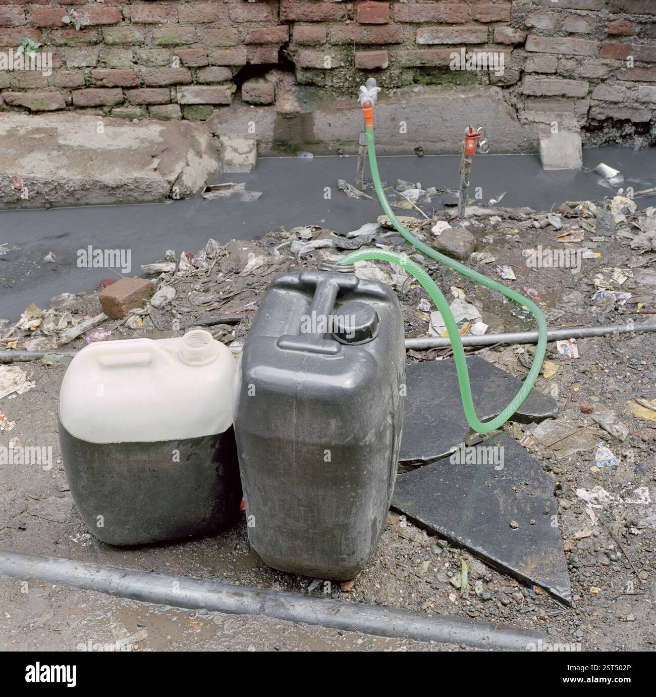 Defying all the sense of hygiene potable water pipe lines are running ...