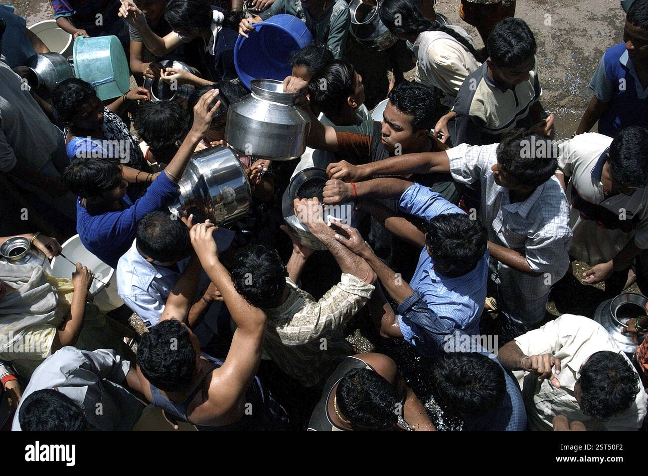 People rushing towards a tanker for water at Parel, Mumbai bombay ...