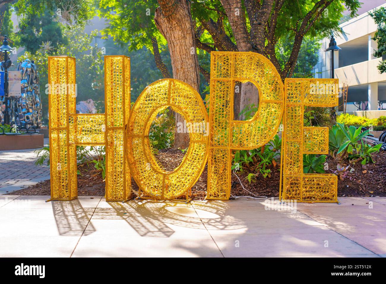 Artistic 'HOPE' sign crafted from colorful material, set against ...