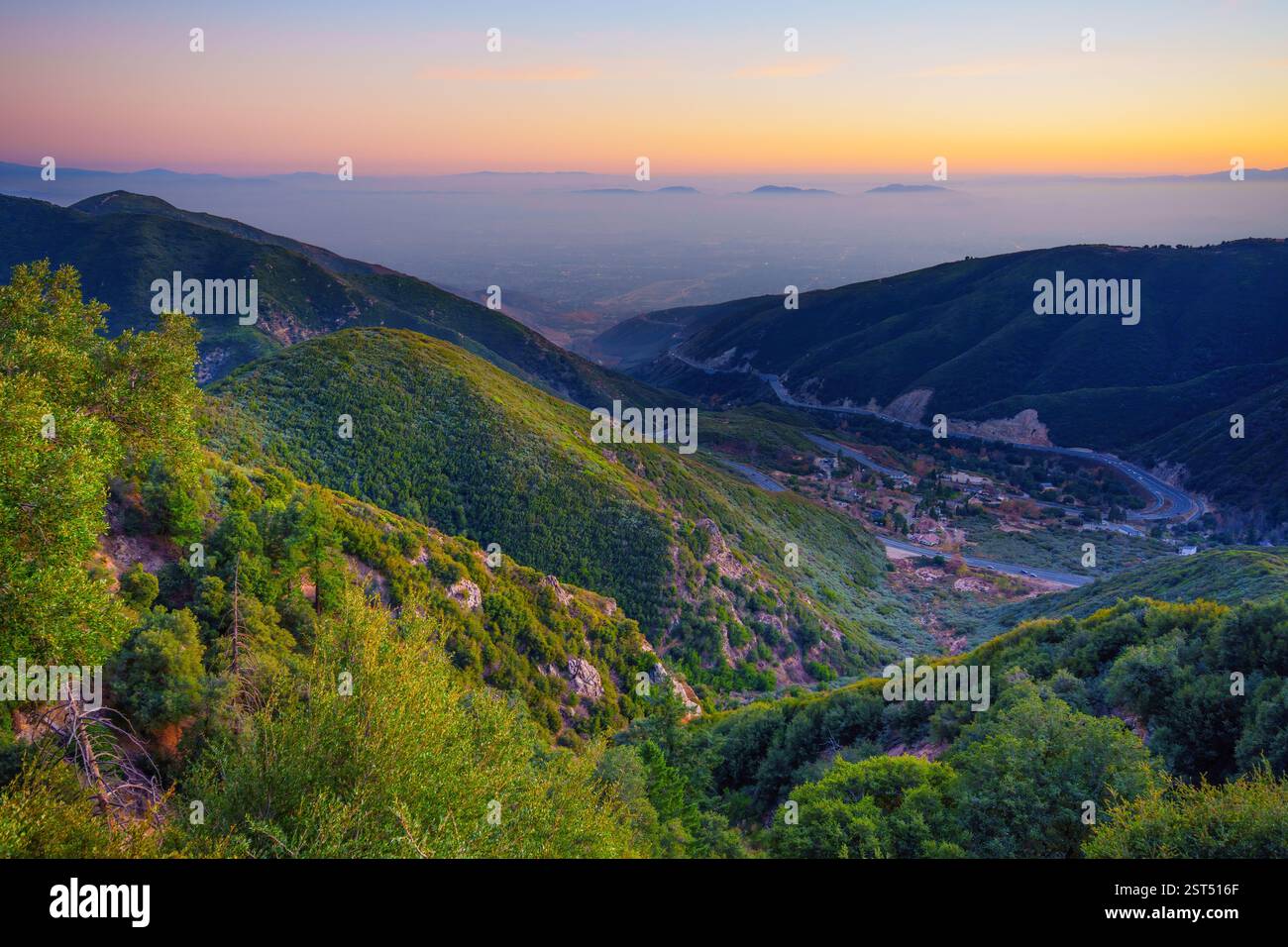 Breathtaking landscape showcases rolling hills and vibrant sunset in ...