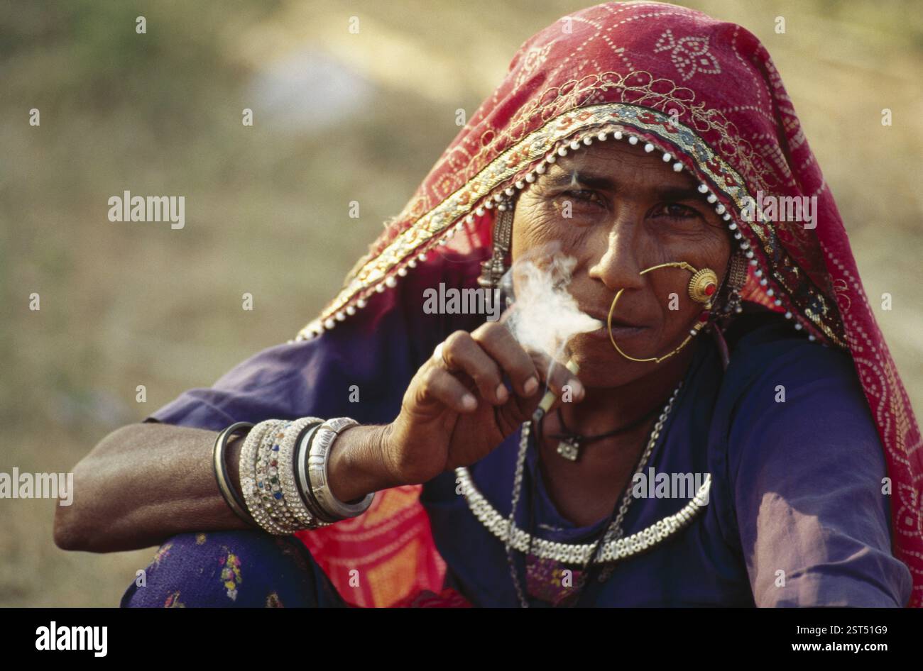 Rural woman smoking, pushkar fair, rajasthan, india Stock Photo - Alamy