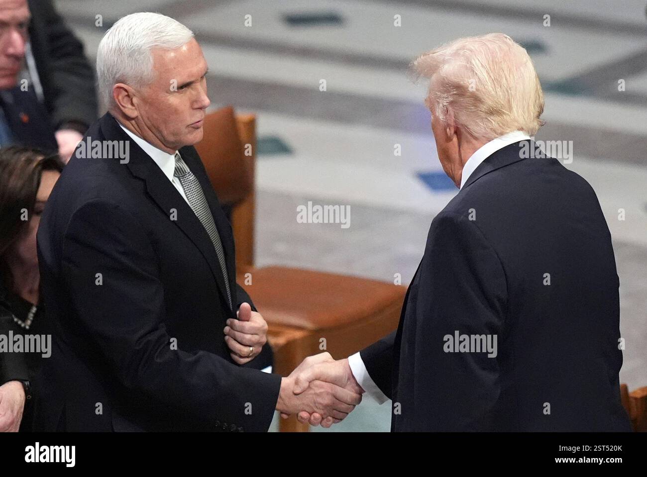 FILE - President-elect Donald Trump, right, shakes hands with former Vice President Mike Pence ...