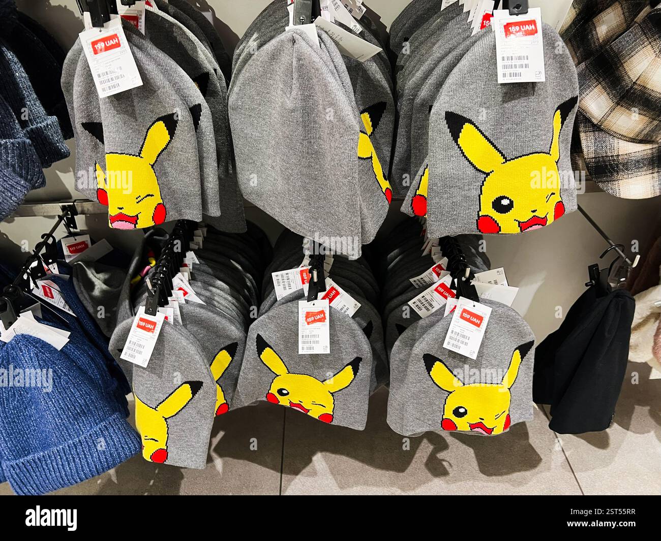 Lviv, Ukraine - February 16, 2025: Rows of gray beanies with Pikachu ...