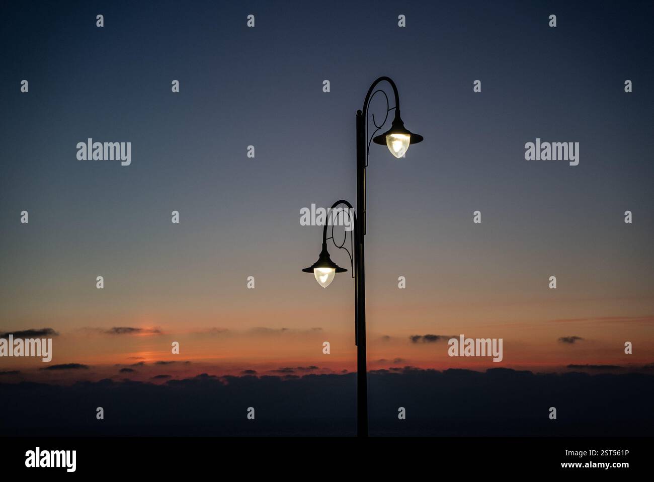 Public street lighting pole with LED lights with sunset color ...
