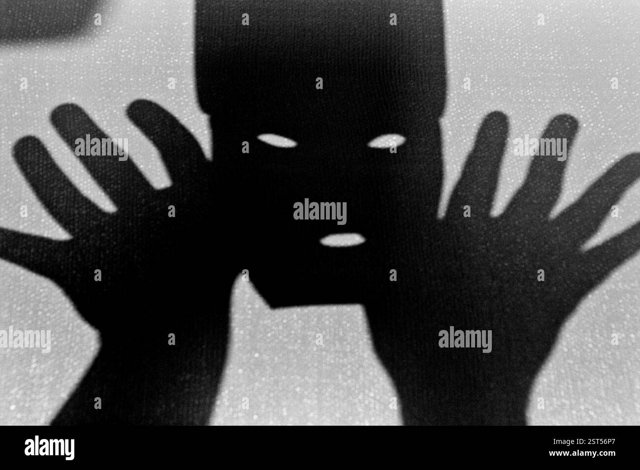 Black and White monochrome horizontal a mask with slit for two eyes and ...