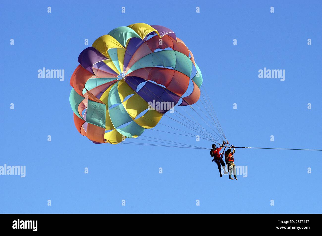 Parasailing two man with colourful parachute on Chowpatty, Marine Drive ...