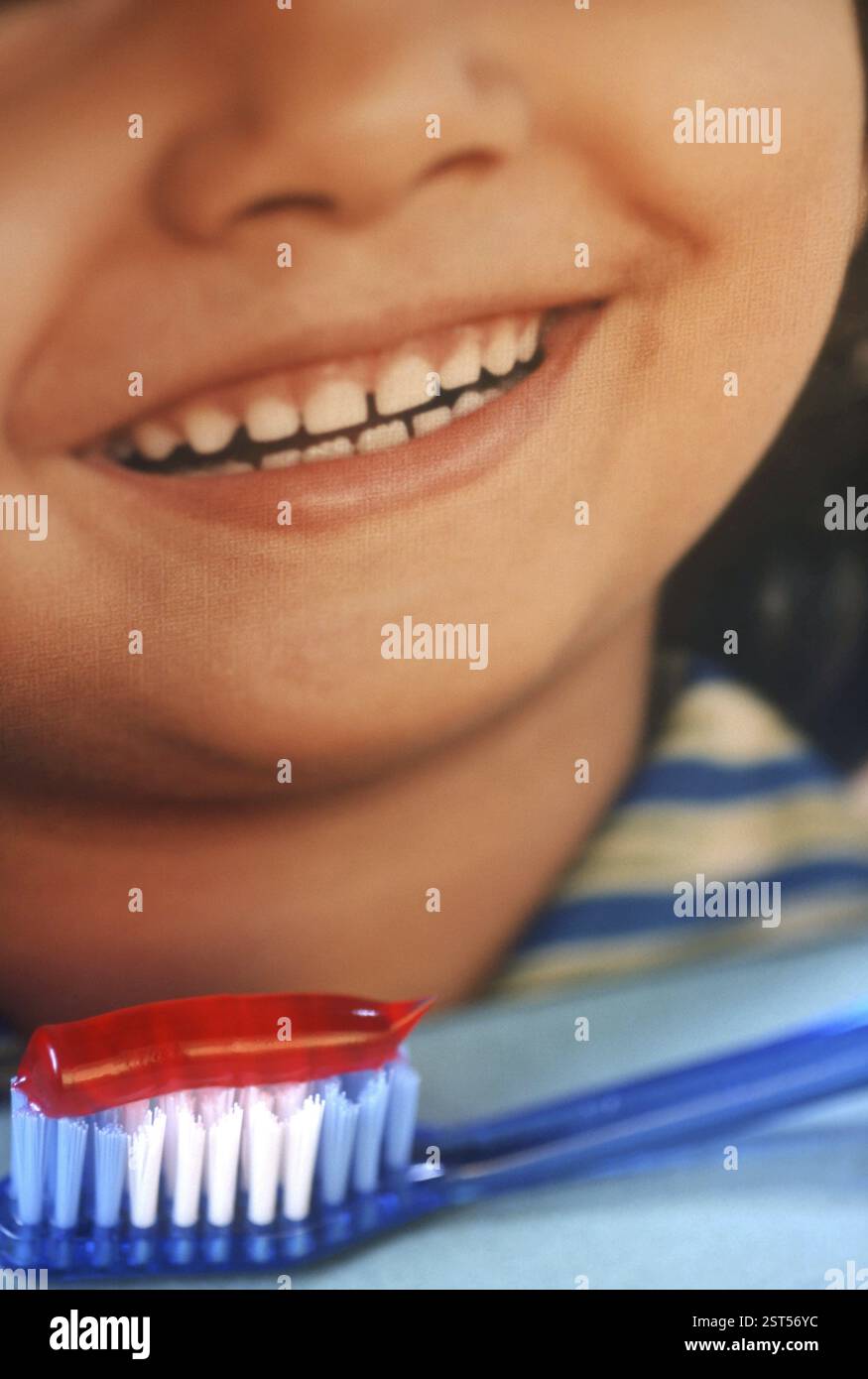 Child with Toothbrush and Toothpaste Stock Photo - Alamy