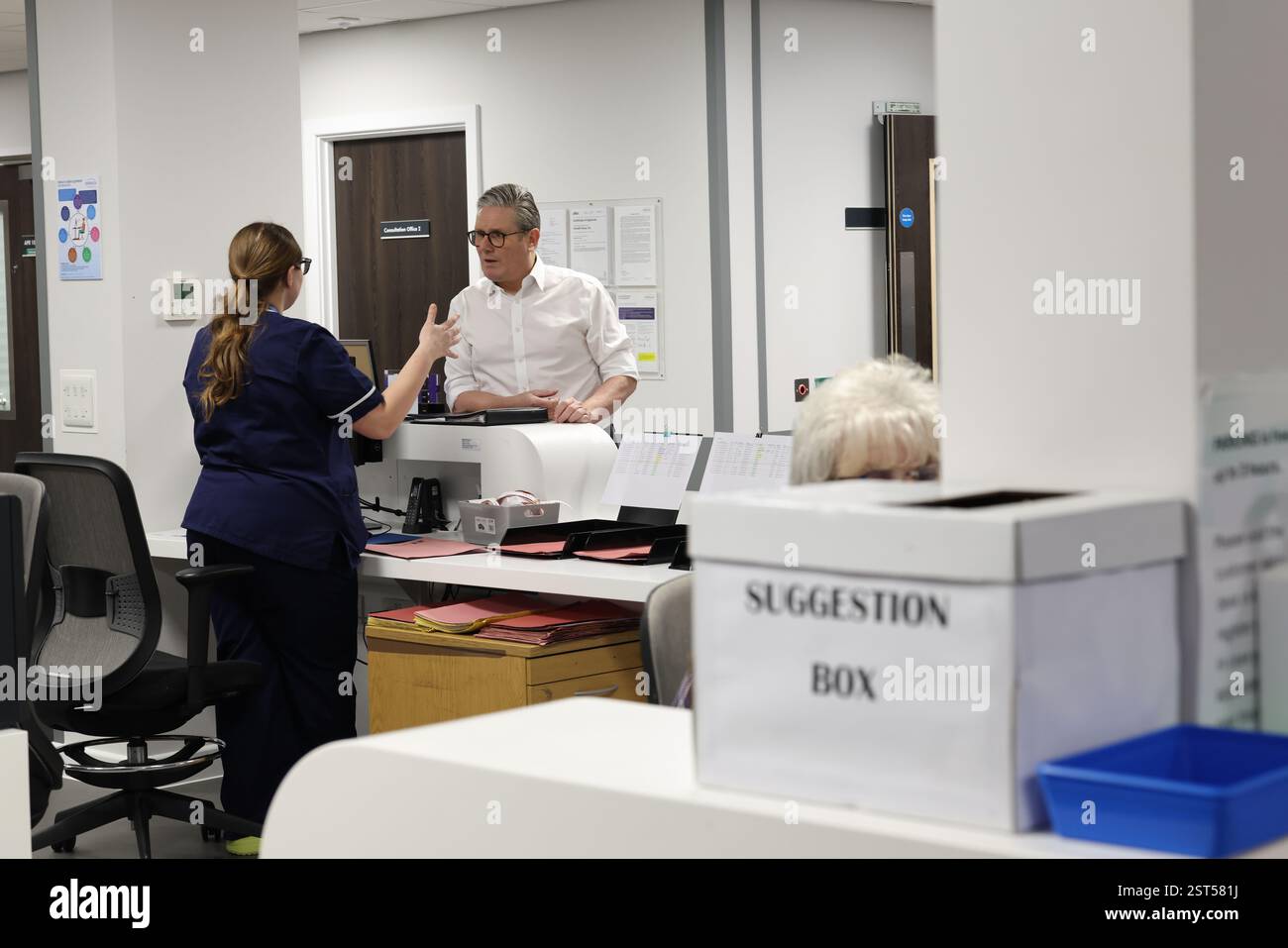 Prime Minister Sir Keir Starmer speaks with a member of staff at the ...