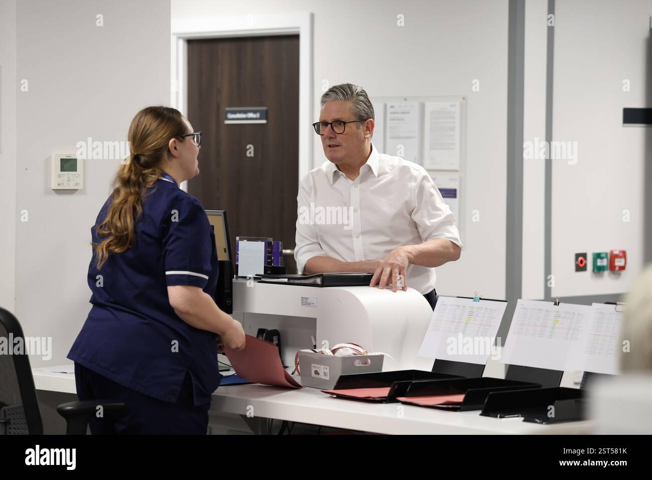 Prime Minister Sir Keir Starmer speaks with a member of staff at the ...