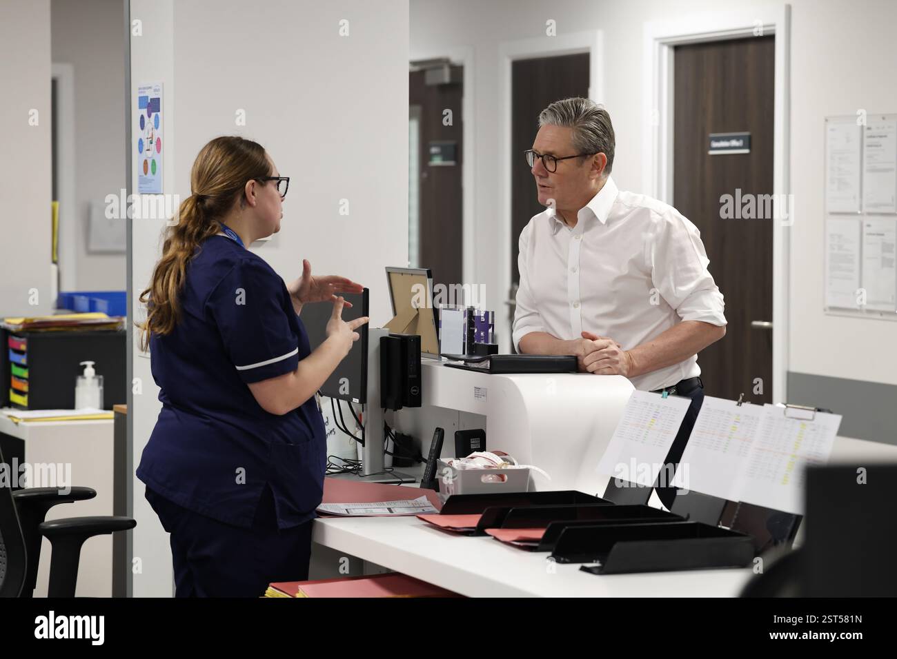 Prime Minister Sir Keir Starmer speaks with a member of staff at the ...