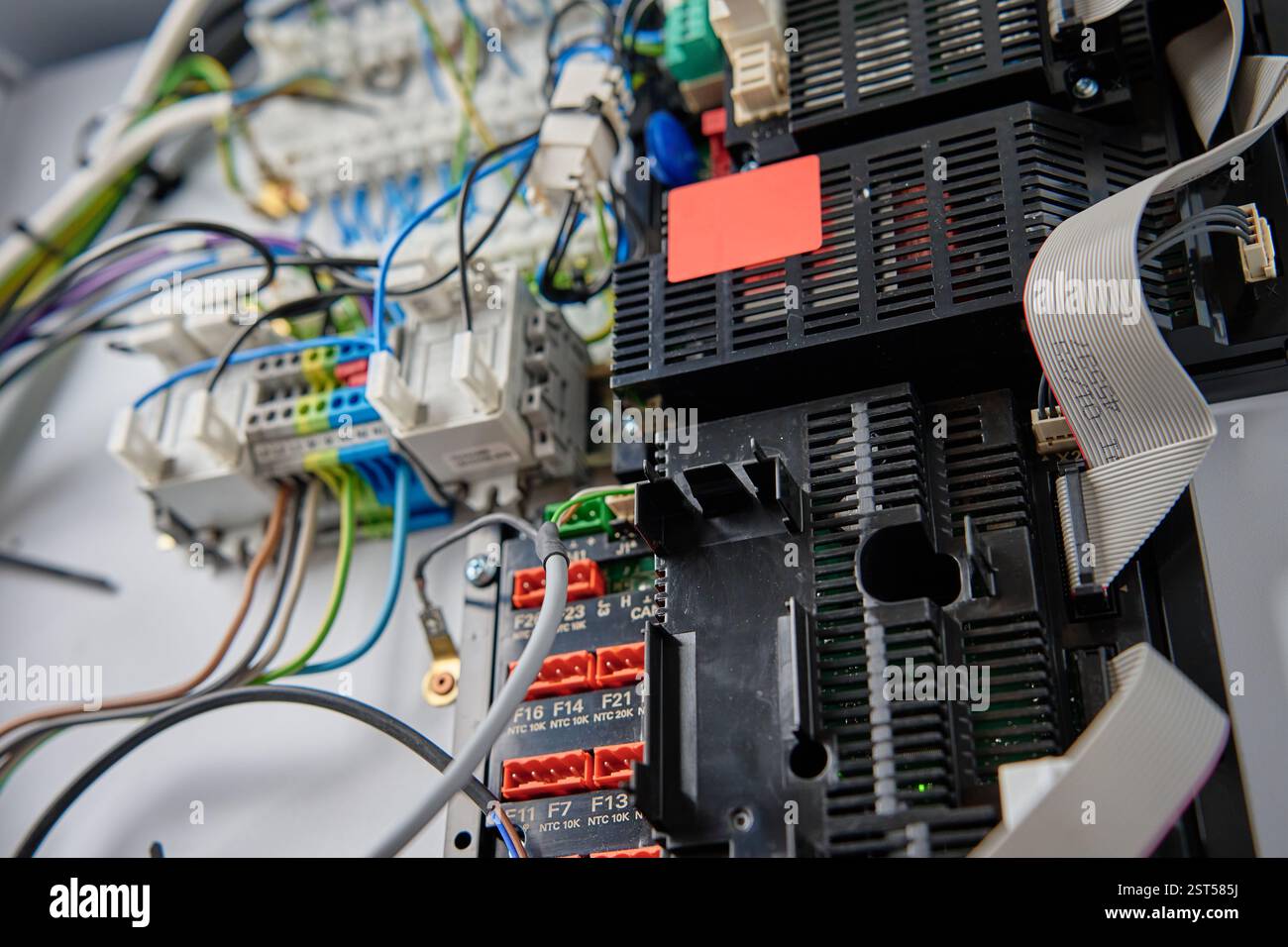 Close-up view of wiring system and circuit board inside electrical ...