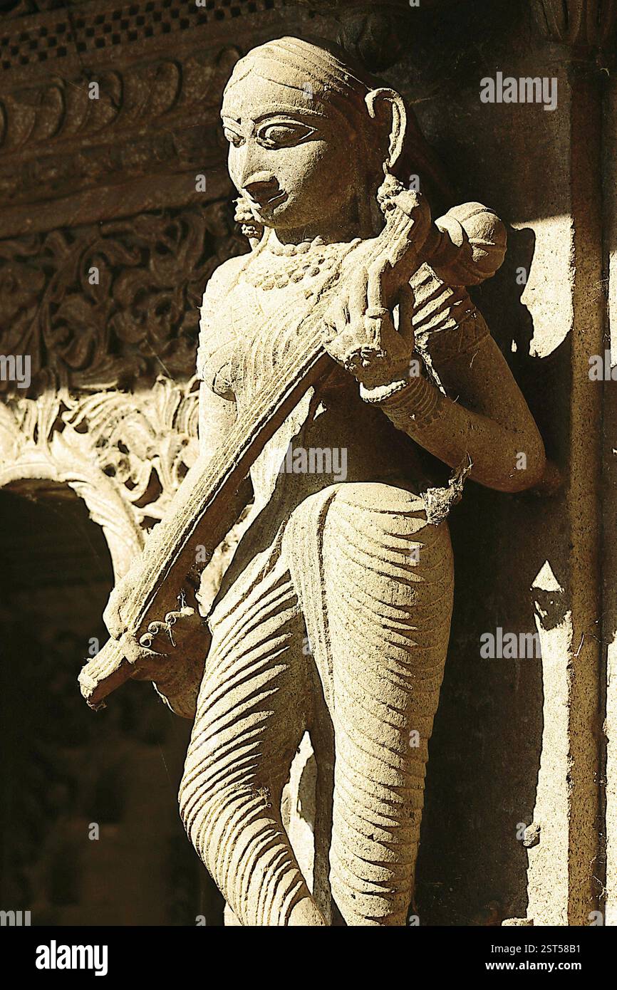 Indian musician, woman playing Veena, carved on wall of Ahilayabai ...