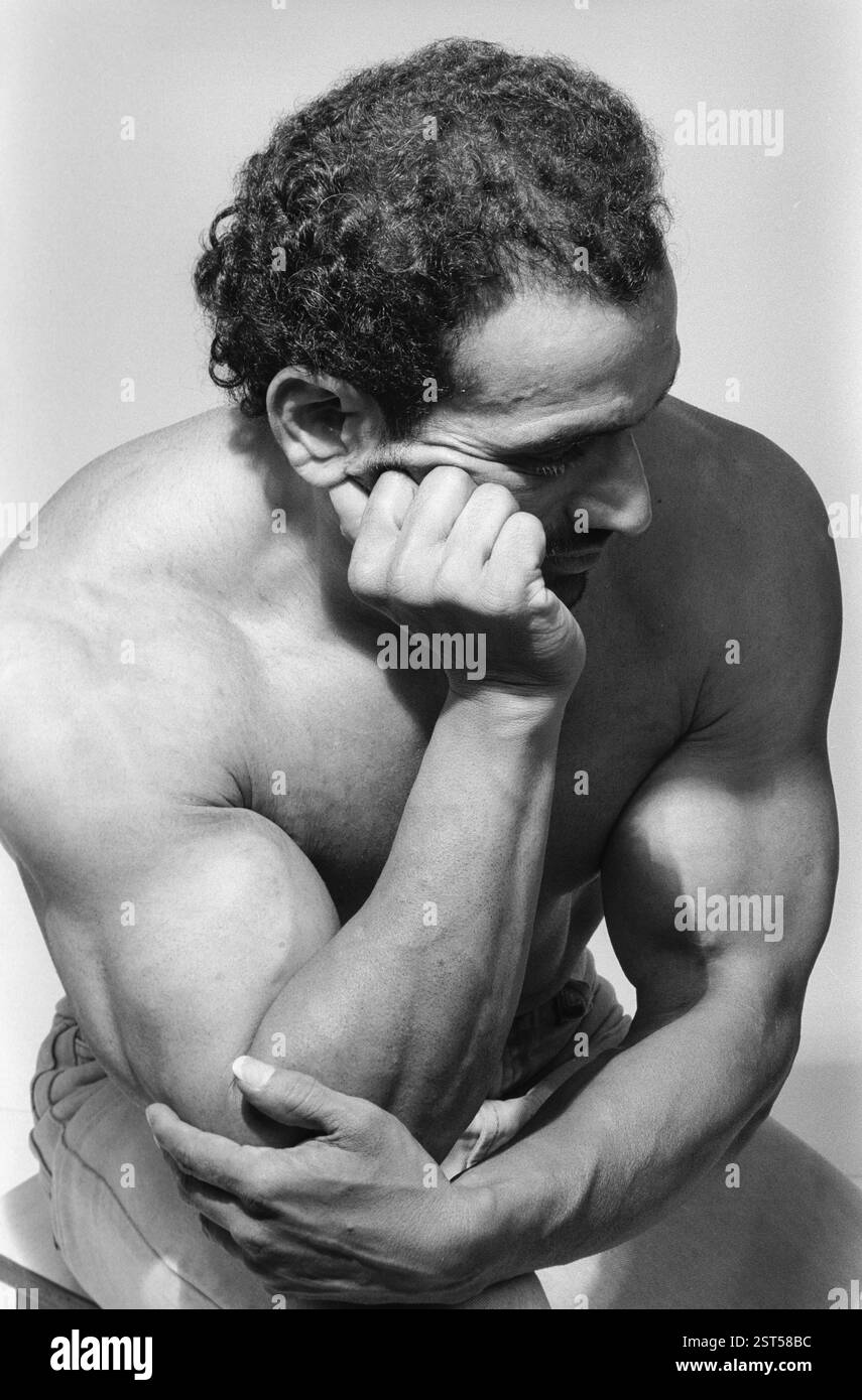 Young Indian Body builder showing his muscles Stock Photo - Alamy