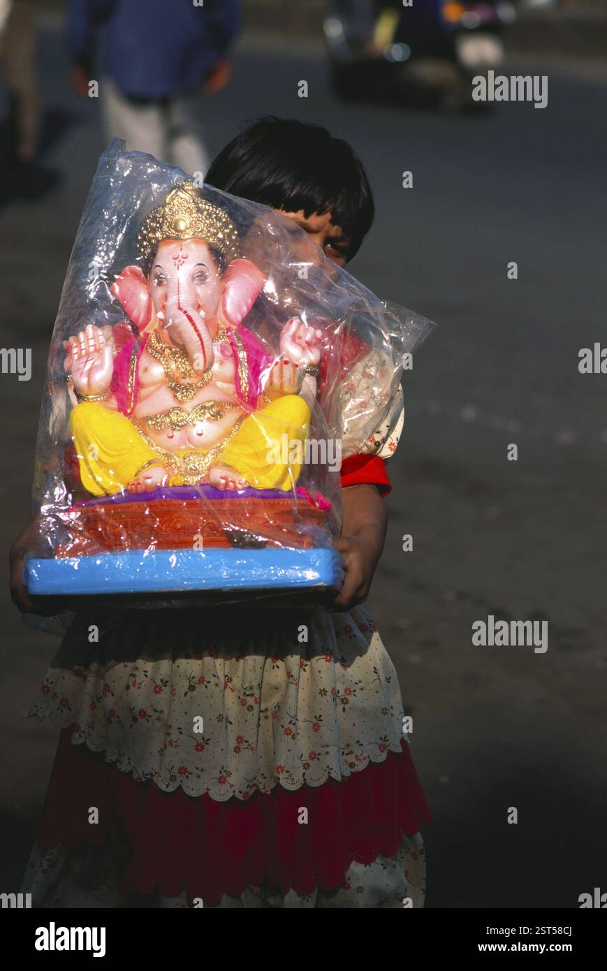 Girl holding statue of Ganesh ganpati Festival Elephant head Lord ...