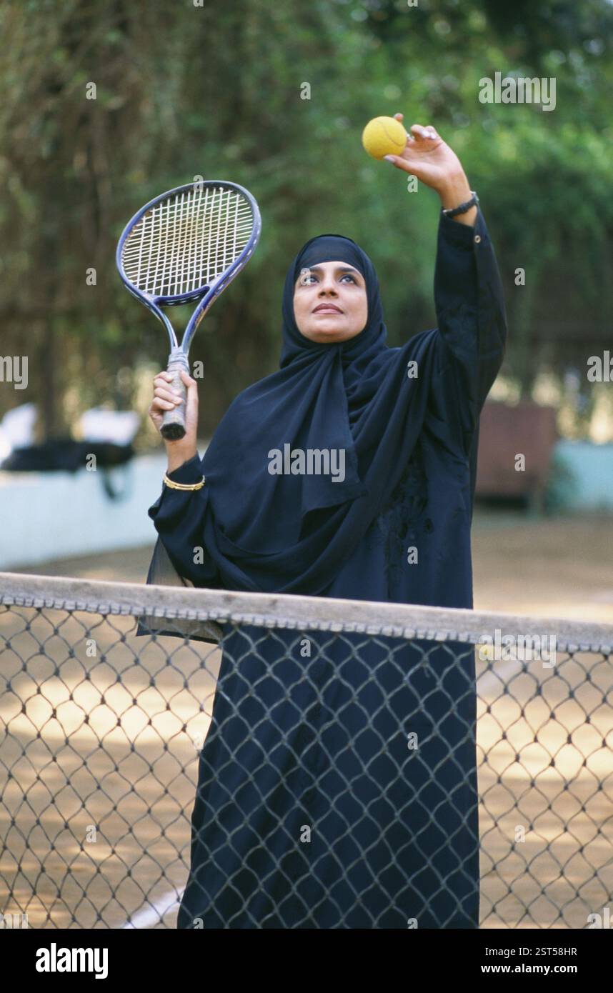 Muslim lady playing tennis MR#307 Stock Photo - Alamy