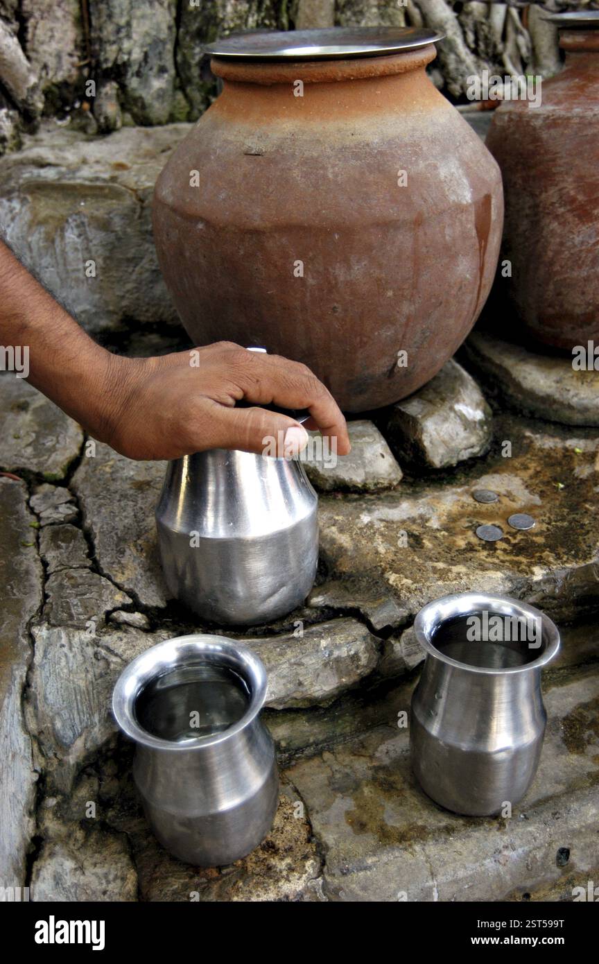 Free cold water from earthen pots being distributed in stainless steel ...
