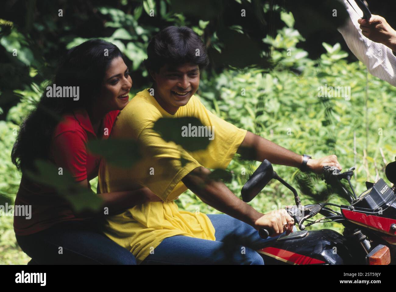 Young couple riding bike, india MR Stock Photo - Alamy