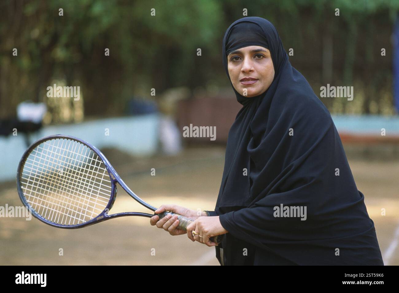 Muslim lady playing tennis MR#307 Stock Photo - Alamy