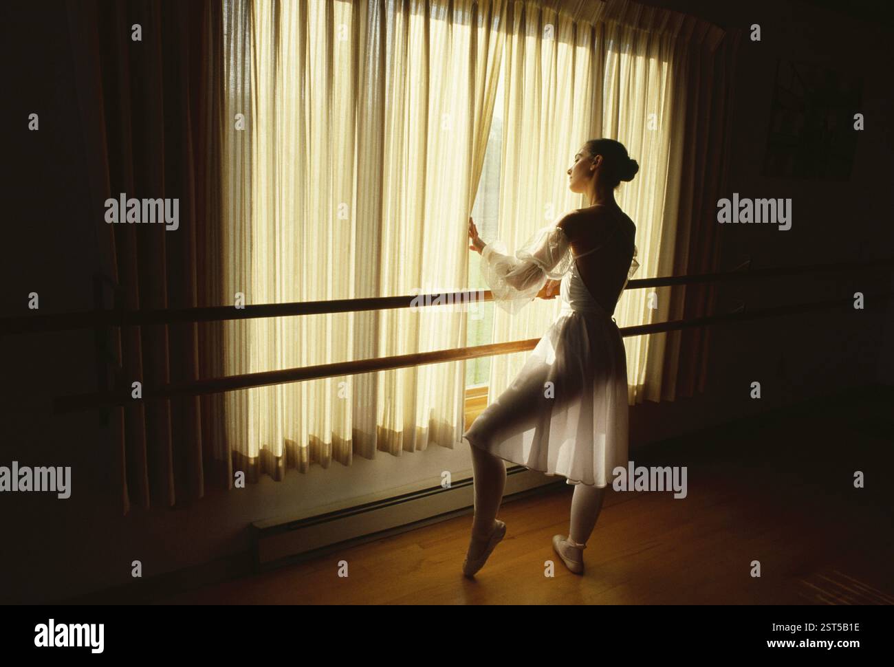 Ballet dancer looking out of window MR#260 Stock Photo - Alamy
