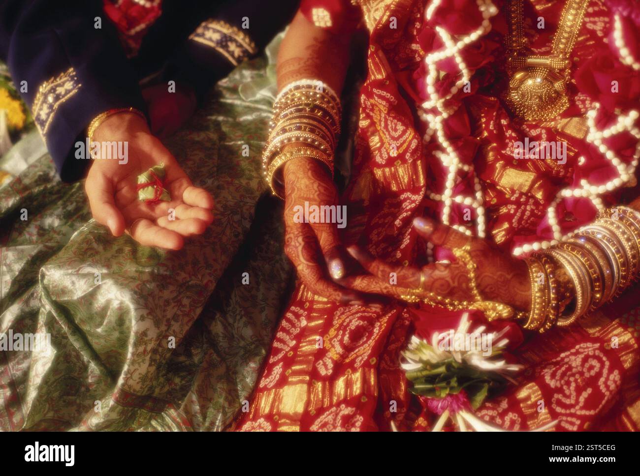 Bride and bridegroom performing vidhi in gujarati marriage ceremony ...