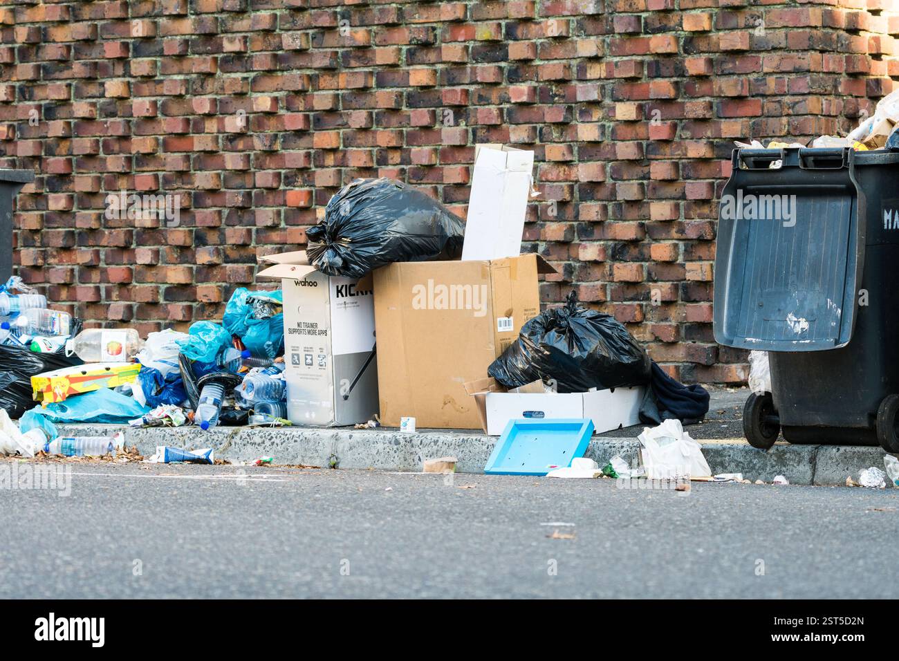 trash, garbage, rubbish overflowing from bins on the pavement or ...