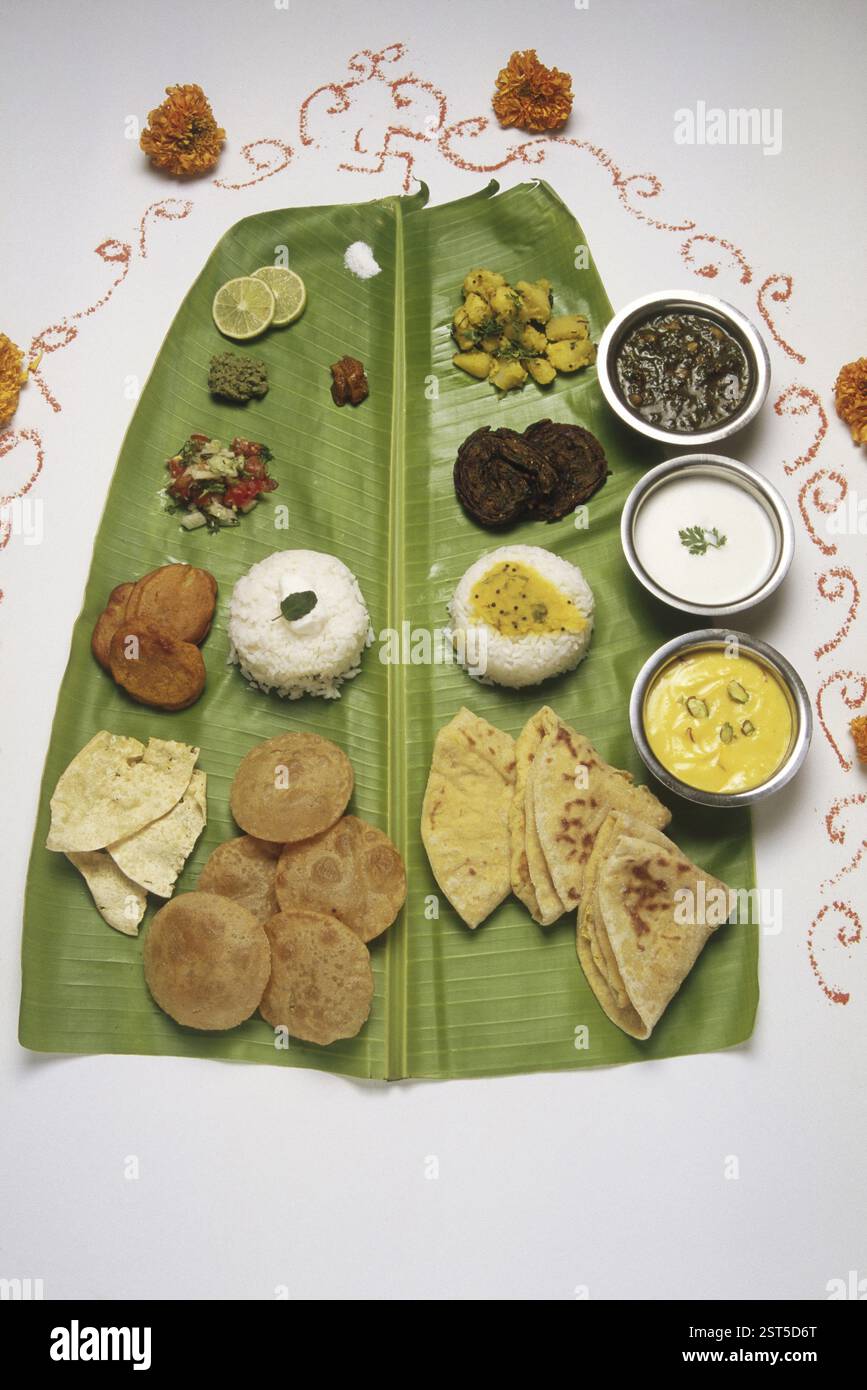 Vegetarian, Maharashtrian food served on banana leaf Stock Photo - Alamy