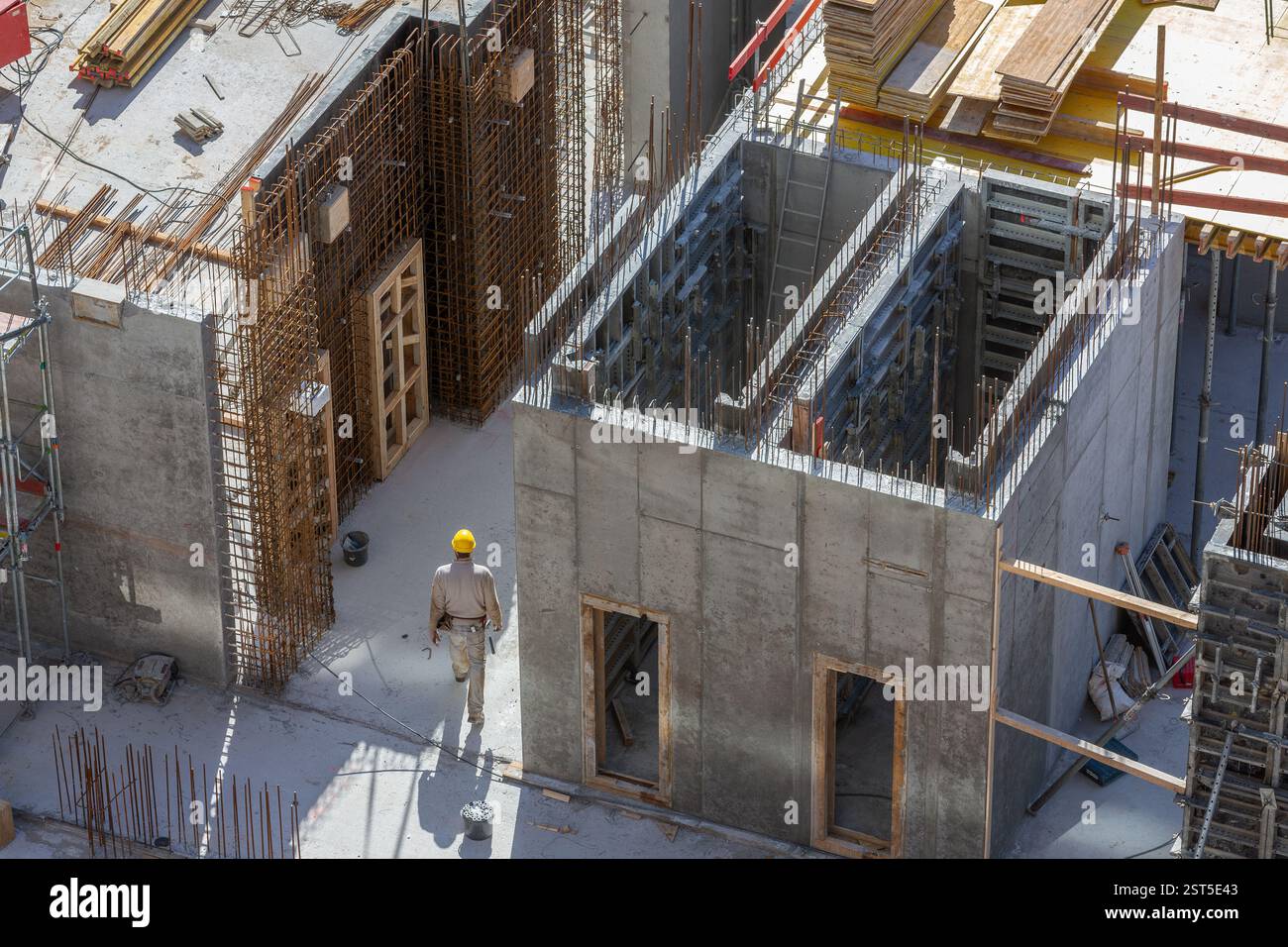 Large construction site with concrete elevator shaft Stock Photo - Alamy