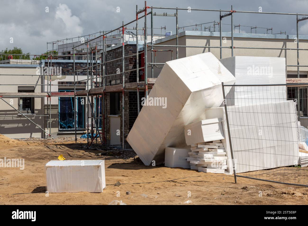 Large packages of white Styrofoam sheets are lying around the ...