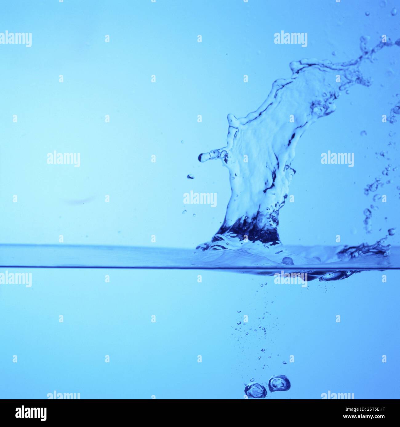 Concept, Water drop splash with blue background Stock Photo - Alamy