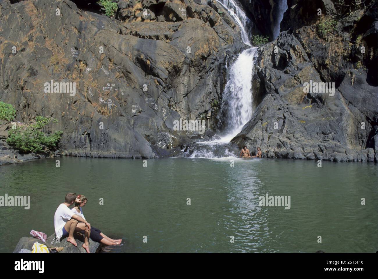 Tourists bathing and sitting at Dudhsagar waterfalls, goa, india Stock ...