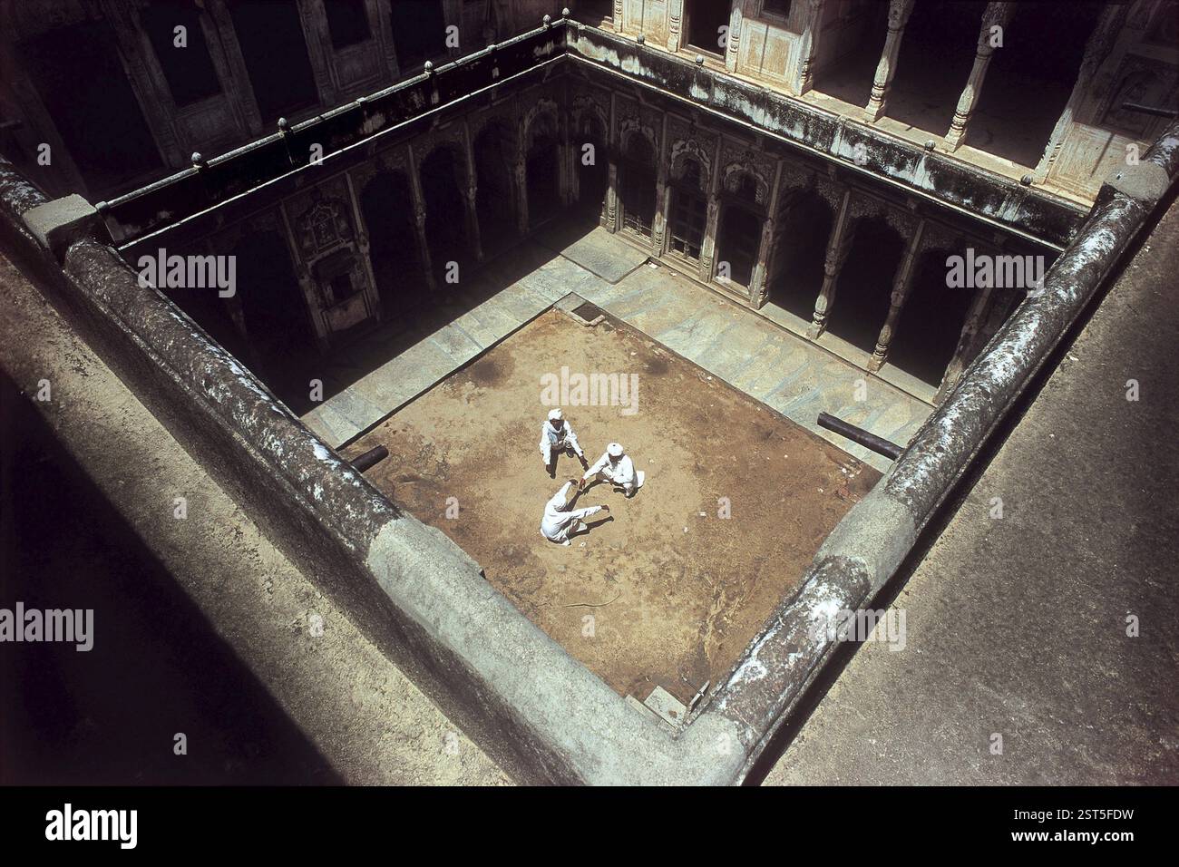 People relaxing in courtyard, Rajasthan, india Stock Photo - Alamy