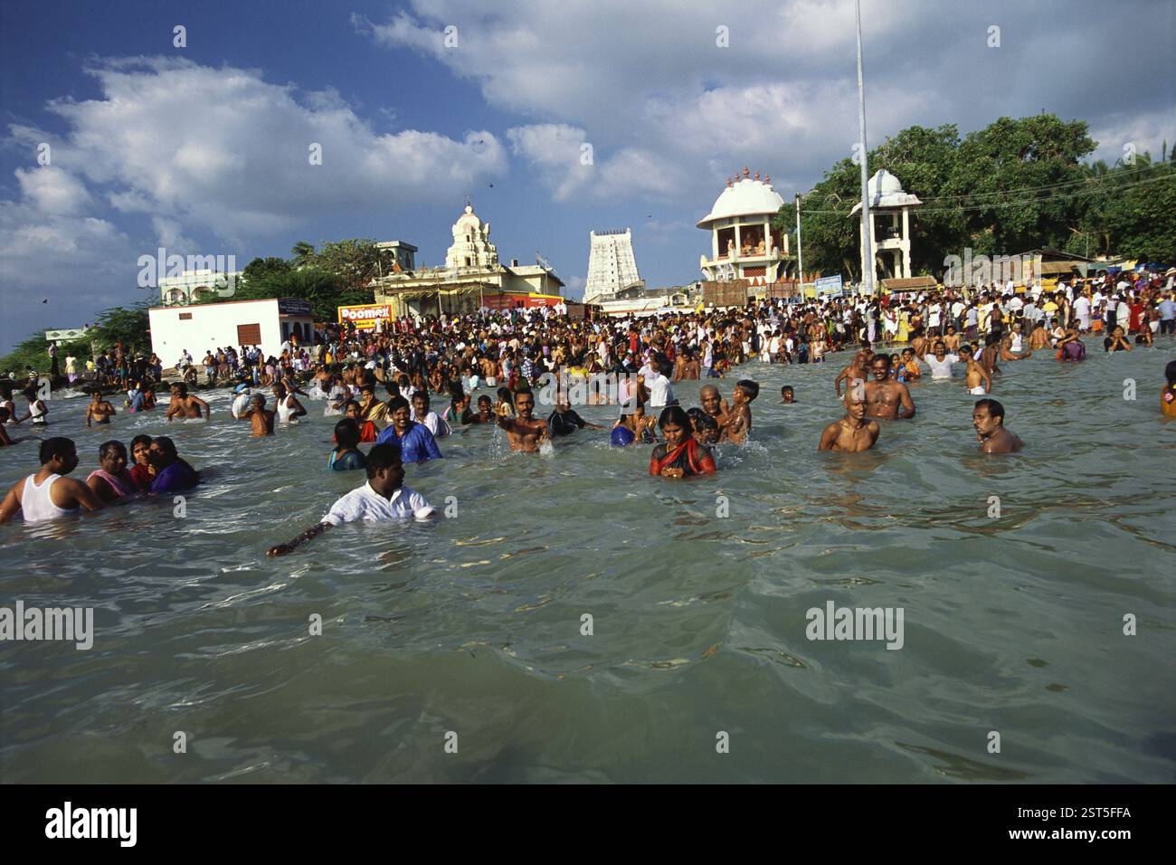 Crowded devotees taking holy dip hi-res stock photography and images ...
