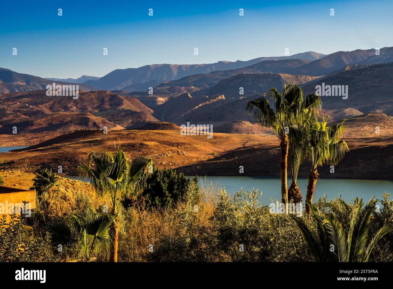 Sunset over the reservoir and High Atlas Mountains at Bin El Ouidane ...