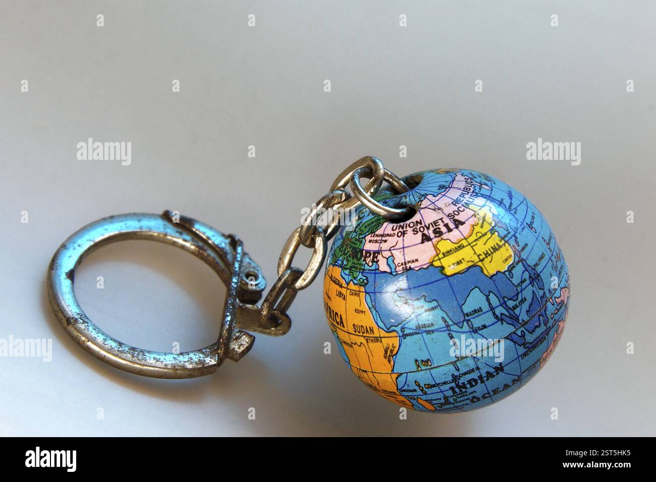 Round globe with key chain of world showing Asia, Indian Ocean, India ...