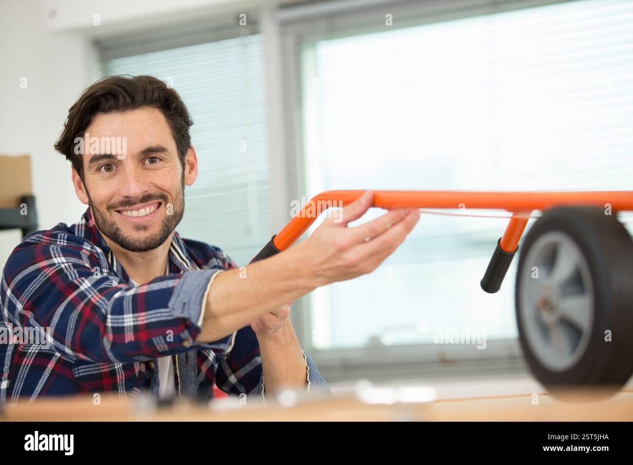 portrait of male engineer operating cnc machinery in factory Stock ...