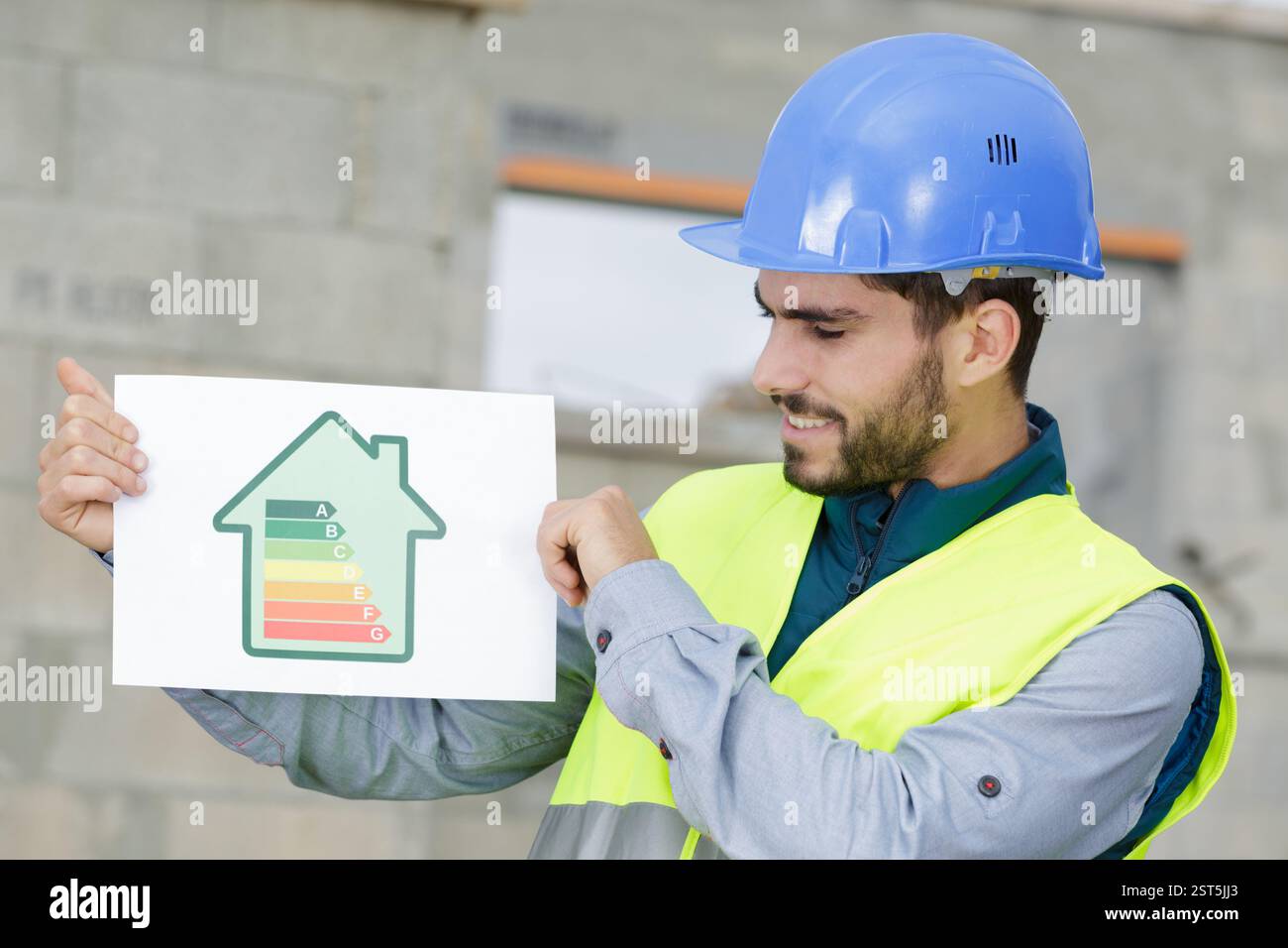 energy efficient chart on house model in office Stock Photo - Alamy
