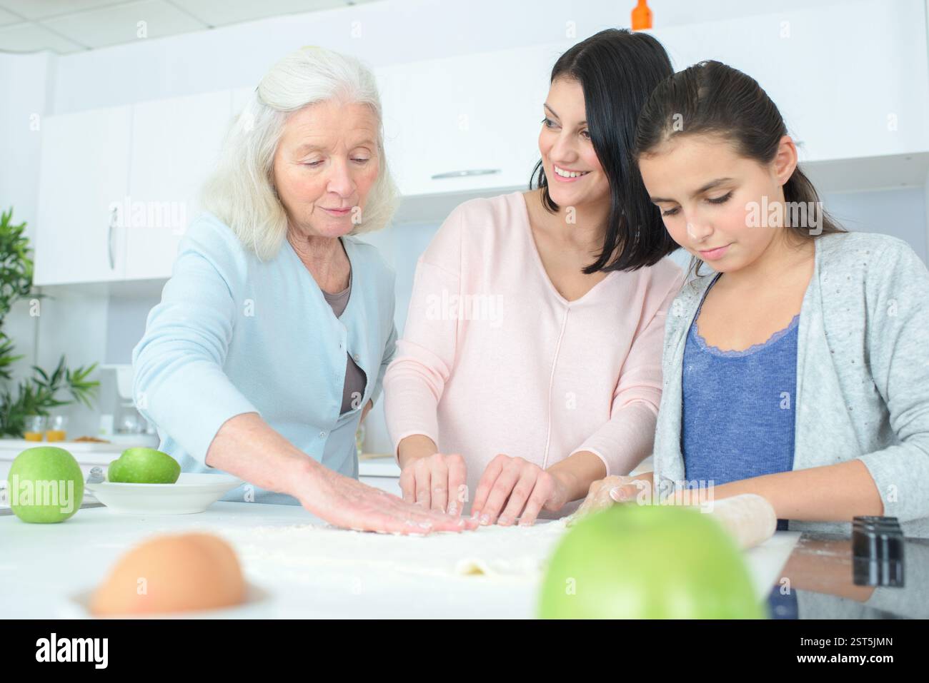 Family making fruit pie hi-res stock photography and images - Alamy