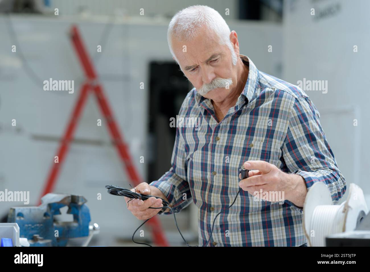 Senior worker using tools hi-res stock photography and images - Alamy