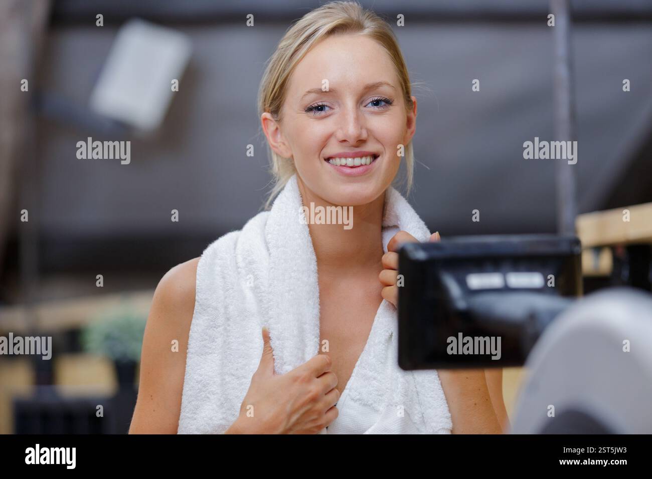 Woman taking break between workout hi-res stock photography and images ...