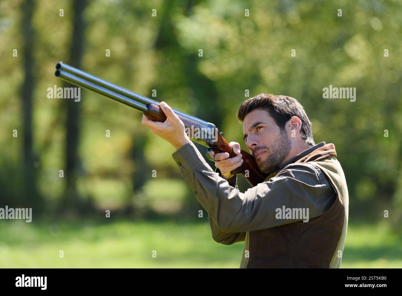 hunter holding an old hunting rifle Stock Photo - Alamy
